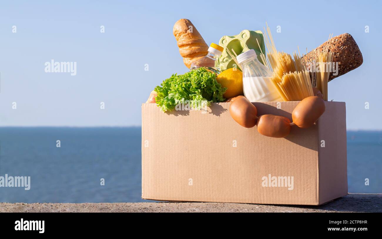 Fresh groceries in cardboard box. Food delivery concept Stock Photo - Alamy