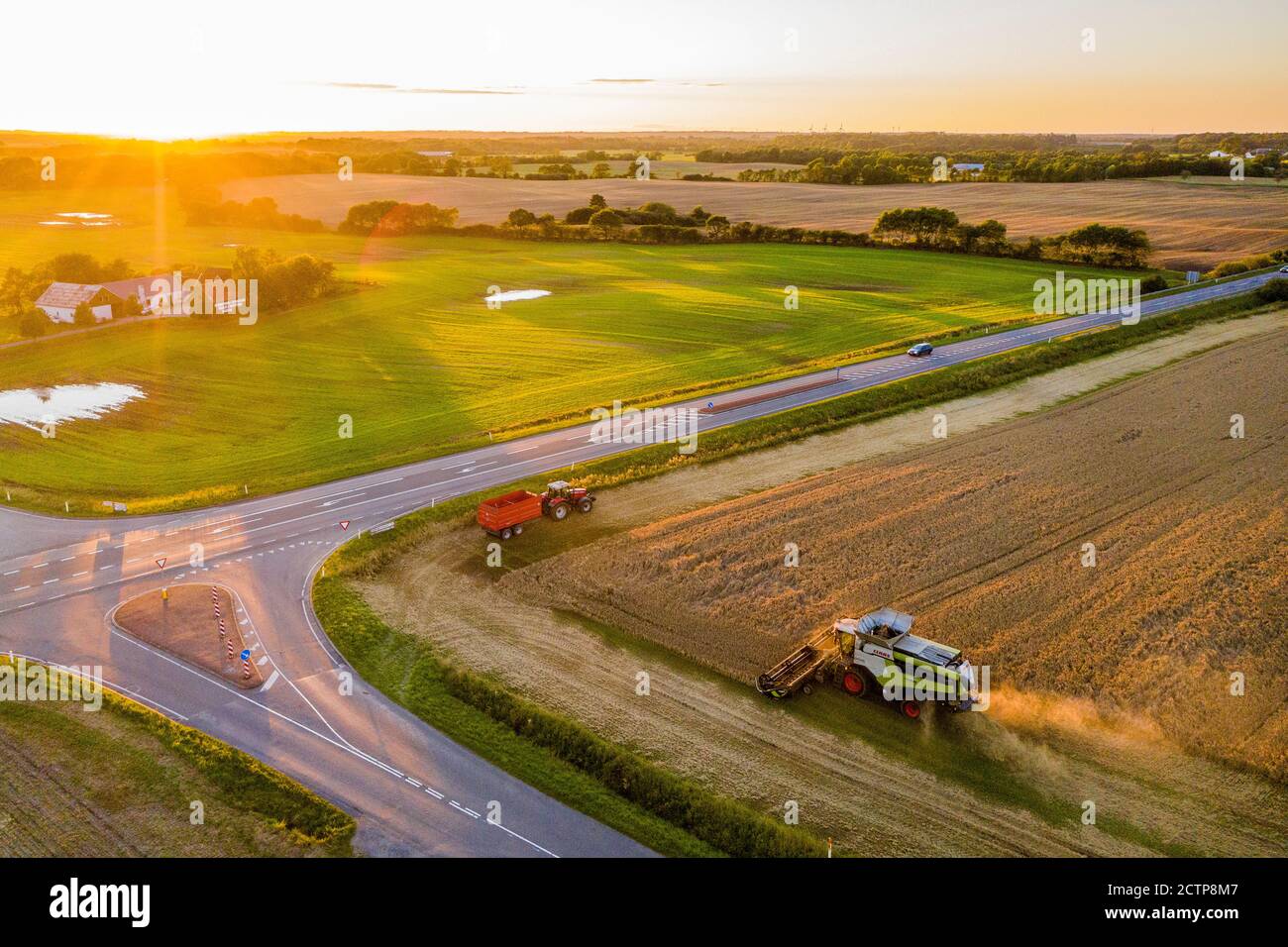 Vejen, Denmark. 01st, September 2020. A farmer is harvesting a barley ...