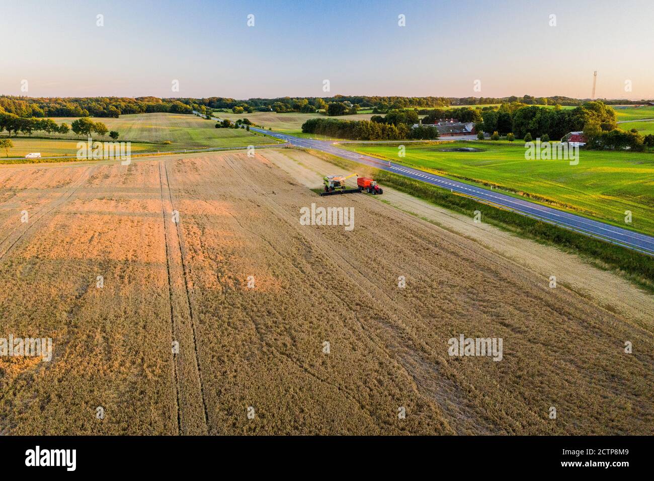 Vejen, Denmark. 01st, September 2020. A farmer is harvesting a barley ...