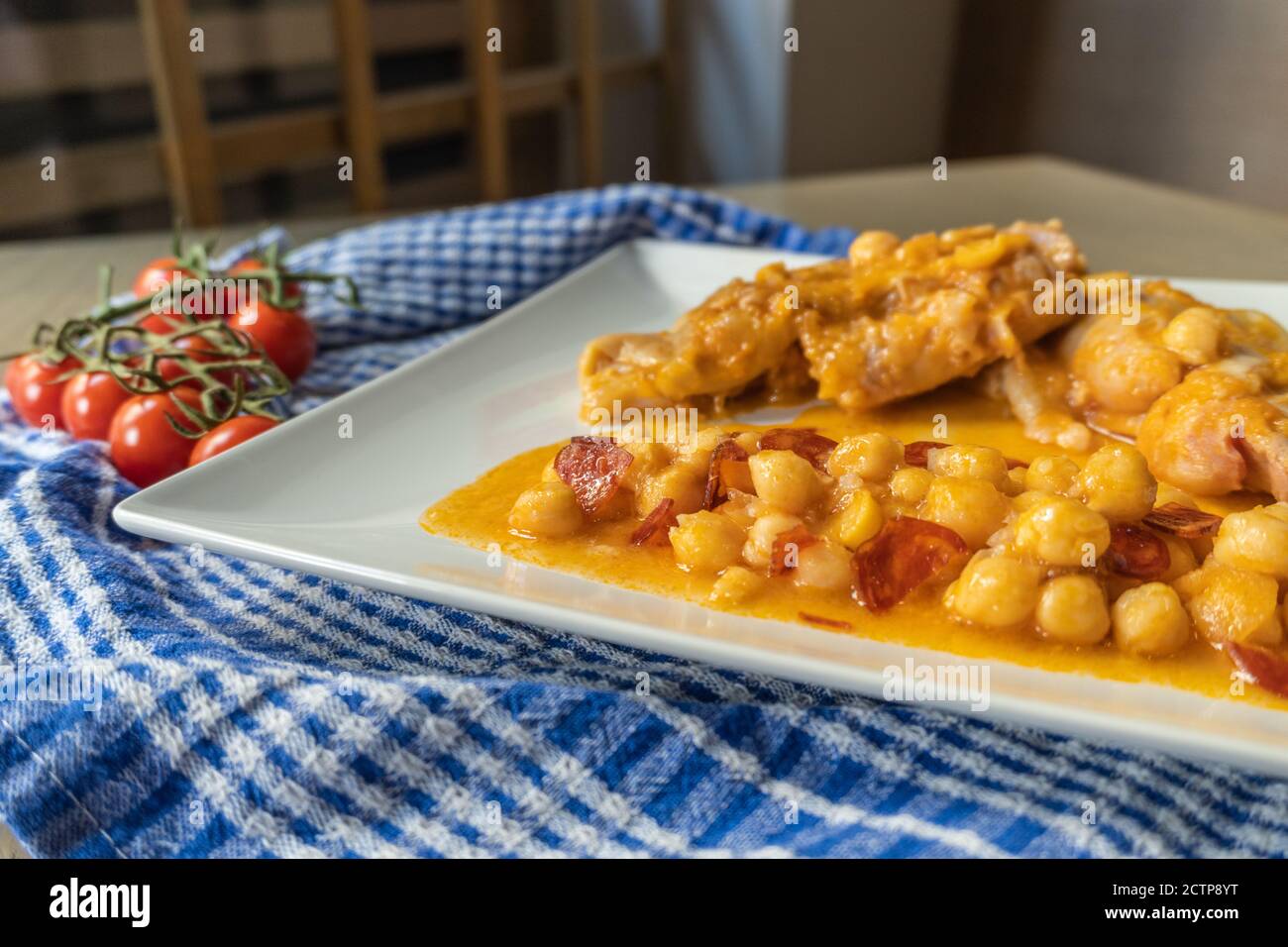 Typical Spanish dish, braised pork feet with chickpeas Stock Photo - Alamy