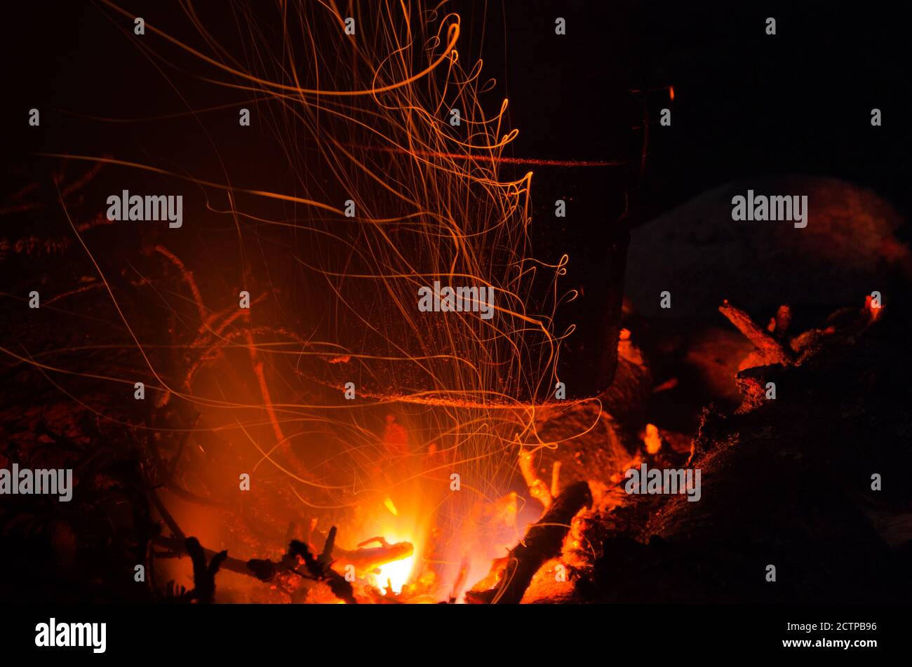 fire burns in the campaign. pot of tea by the fire Stock Photo - Alamy