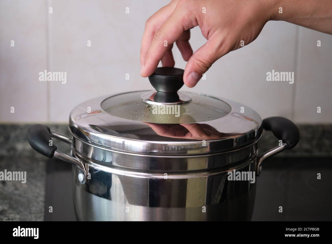 Lifting water pot hi-res stock photography and images - Alamy