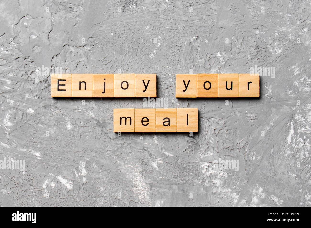 Enjoy your meal word written on wood block. Enjoy your meal text on ...