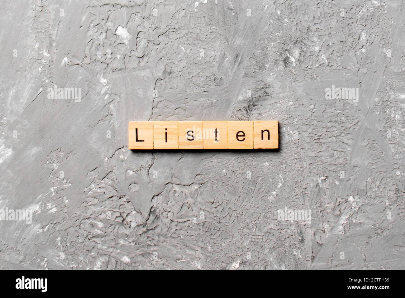 listen word written on wood block. listen text on table, concept Stock ...