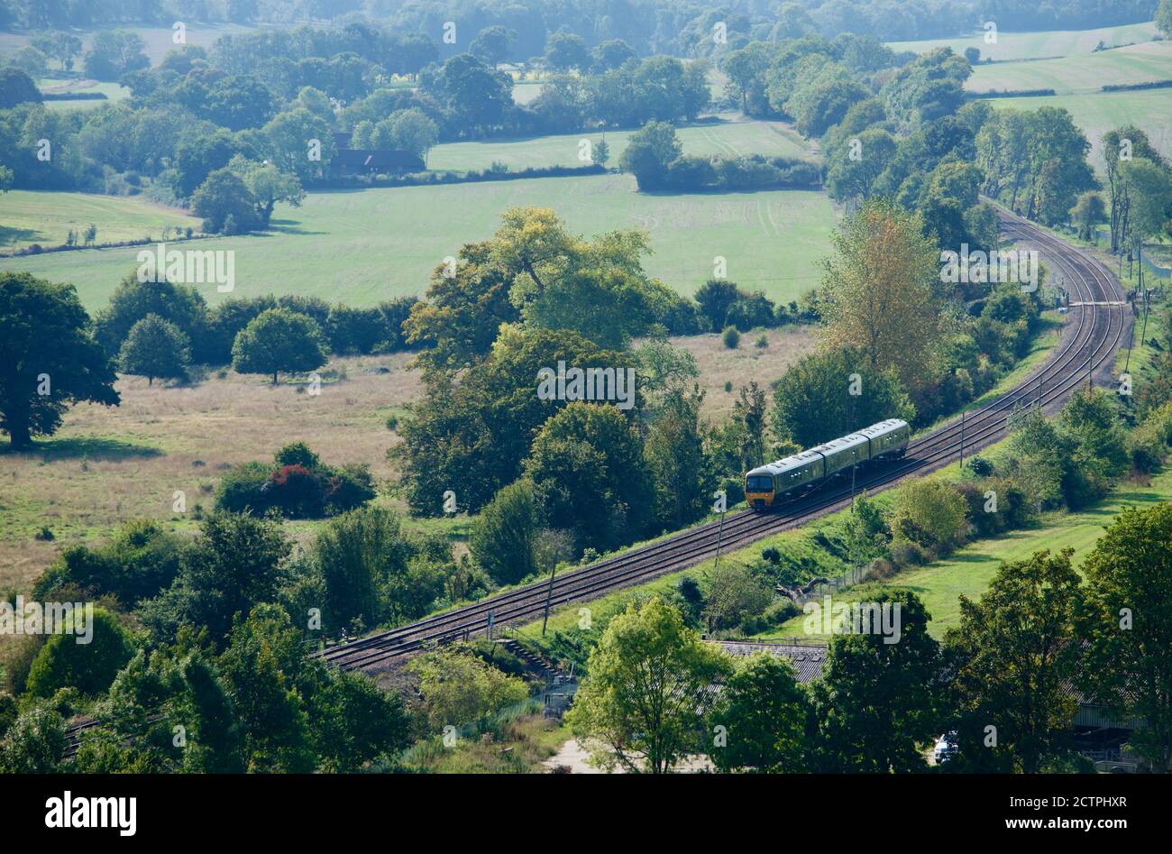 A Great Western Railway train going through the Surrey countryside in ...