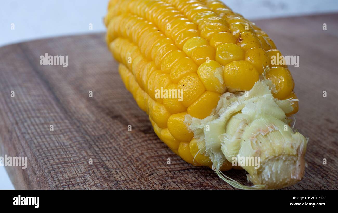 Delicious corn on the cob captured in an extreme close up. The brightly ...