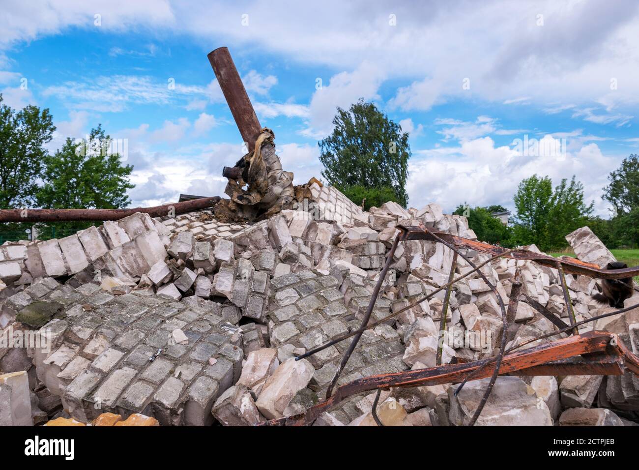 fragments of white brick ruins, remnants of an old iron structure from ...