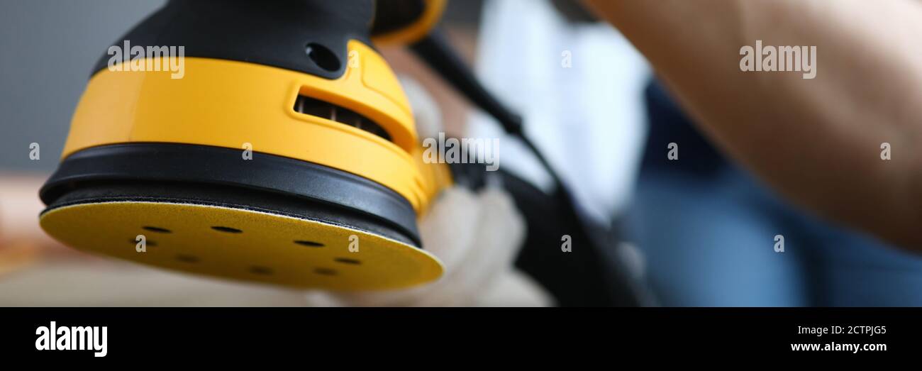 Carpenter using electric sander polish hi-res stock photography and ...