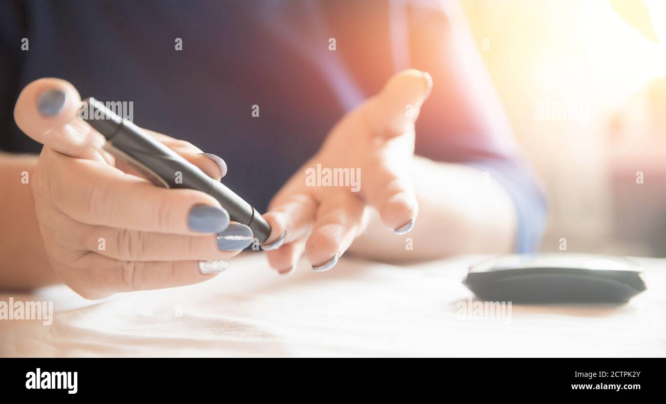 Woman use glucometer for test sugar blood level for diabetes, insulin ...