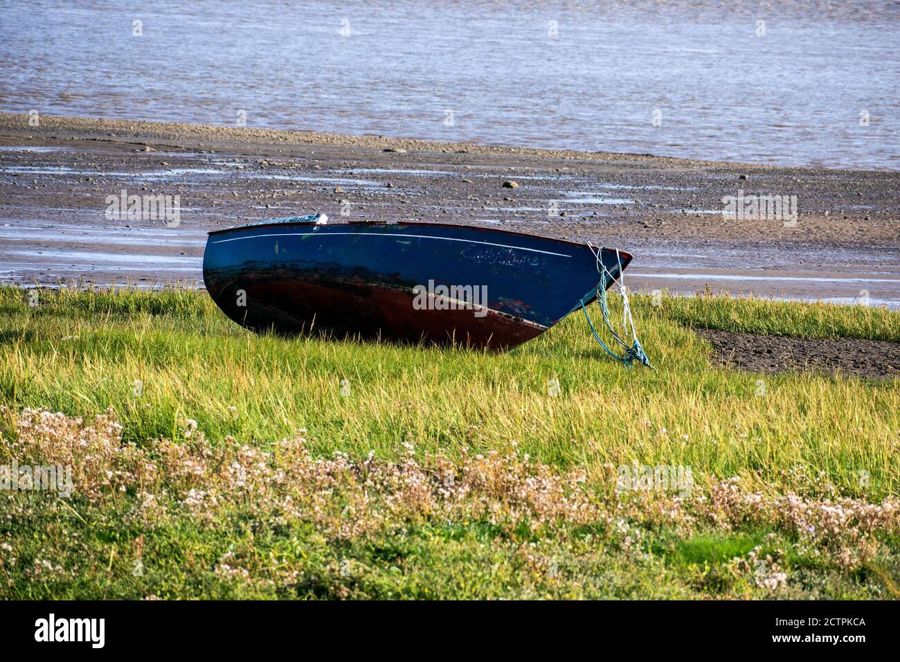 An old boat lies on the Ribble estuary at Lytham St. Annes, Lancashire ...