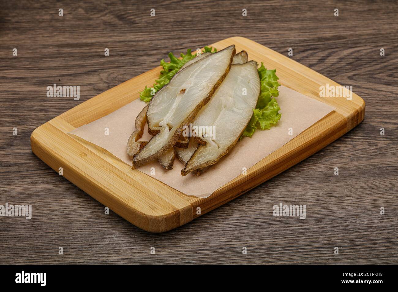Delicous smoked halibut fish slices snack Stock Photo - Alamy