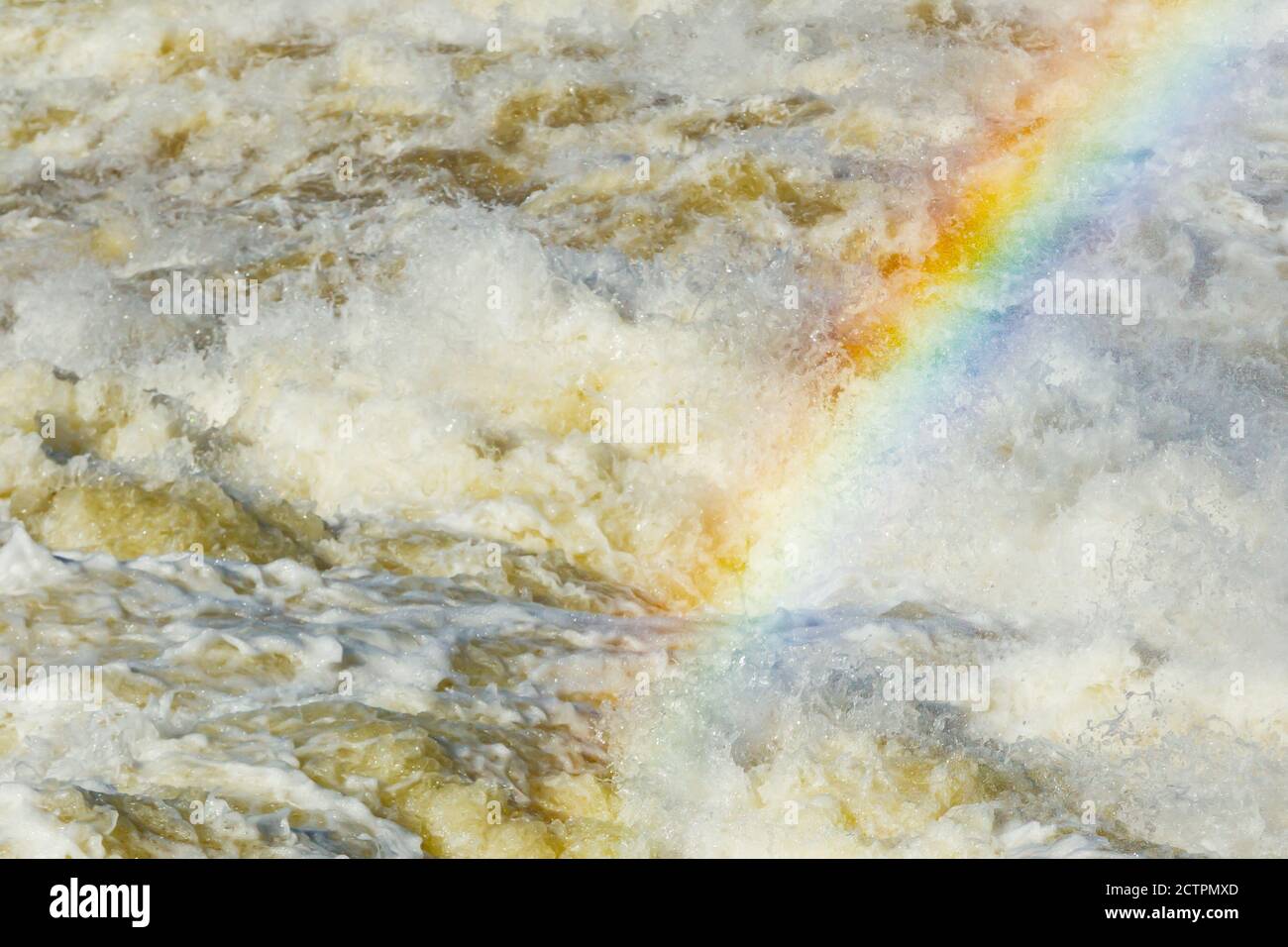Splashing water waves with rainbow on the fast river Stock Photo - Alamy