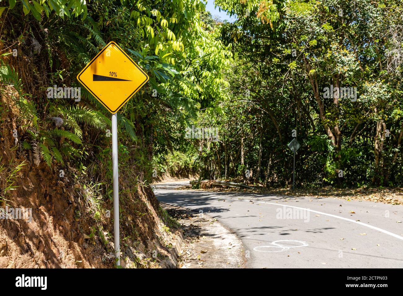 Yellow Diamond Shaped Warning Sign Steep Grade At A Downhill Road In Tuaran District Sabah yellow-diamond-shaped-warning-sign-steep-grade-at-a-downhill-road-in-tuaran-district-sabah