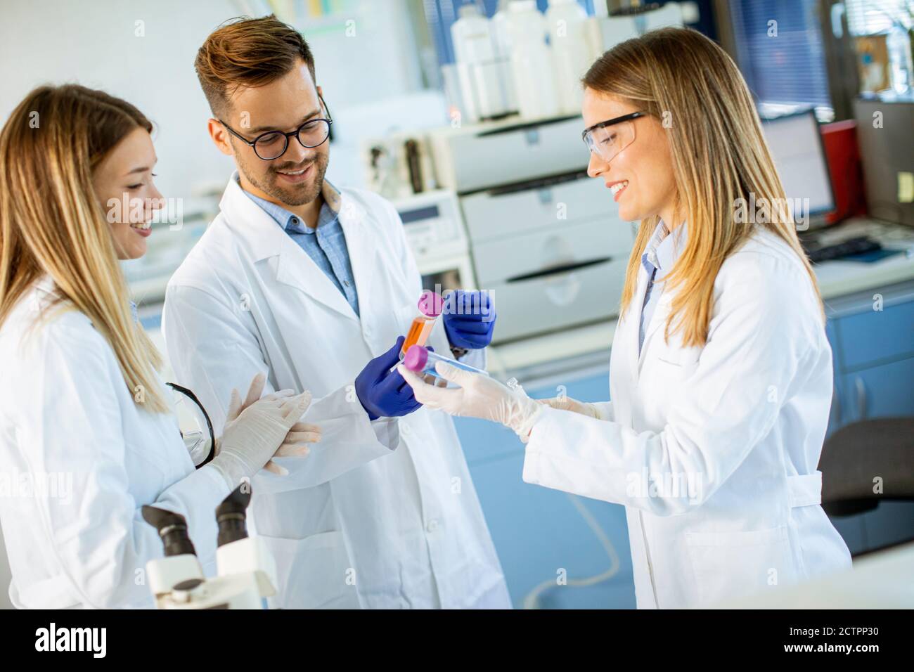 Young researchers analyzing chemical data in the laboratory Stock Photo ...