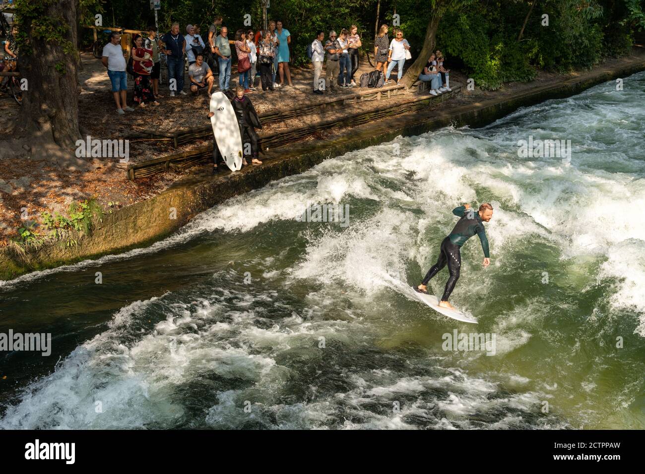 Munich, Bavaria / Germany - 17 September 2020: man surfing the standing ...