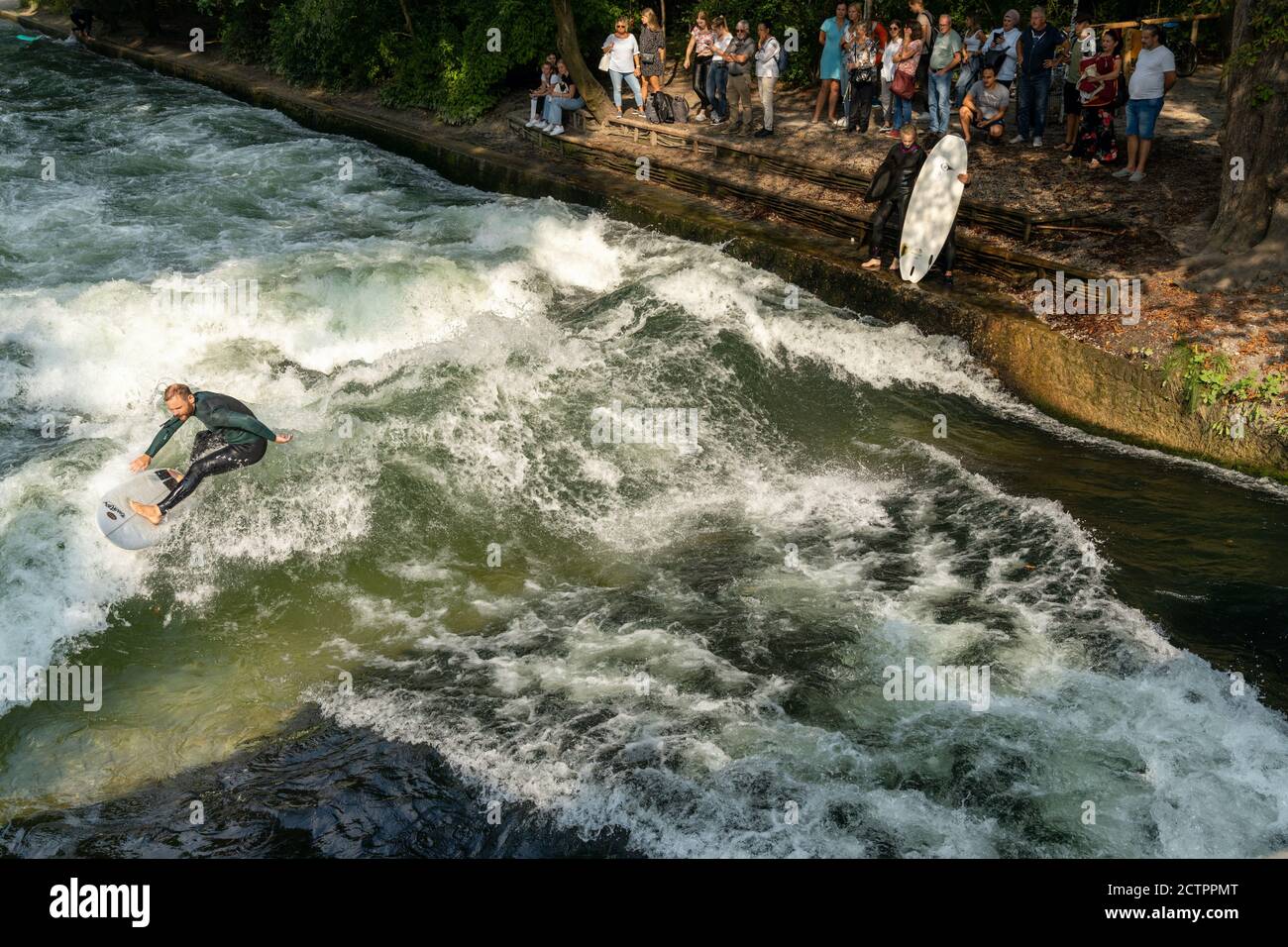Munich, Bavaria / Germany - 17 September 2020: man surfing the standing ...