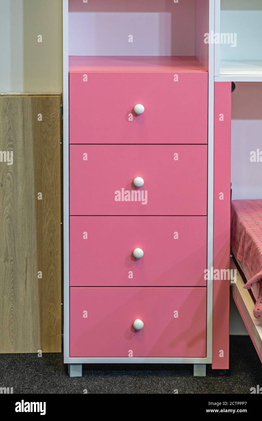 Pink Drawers Cabinet Furniture in Girls Room Stock Photo - Alamy