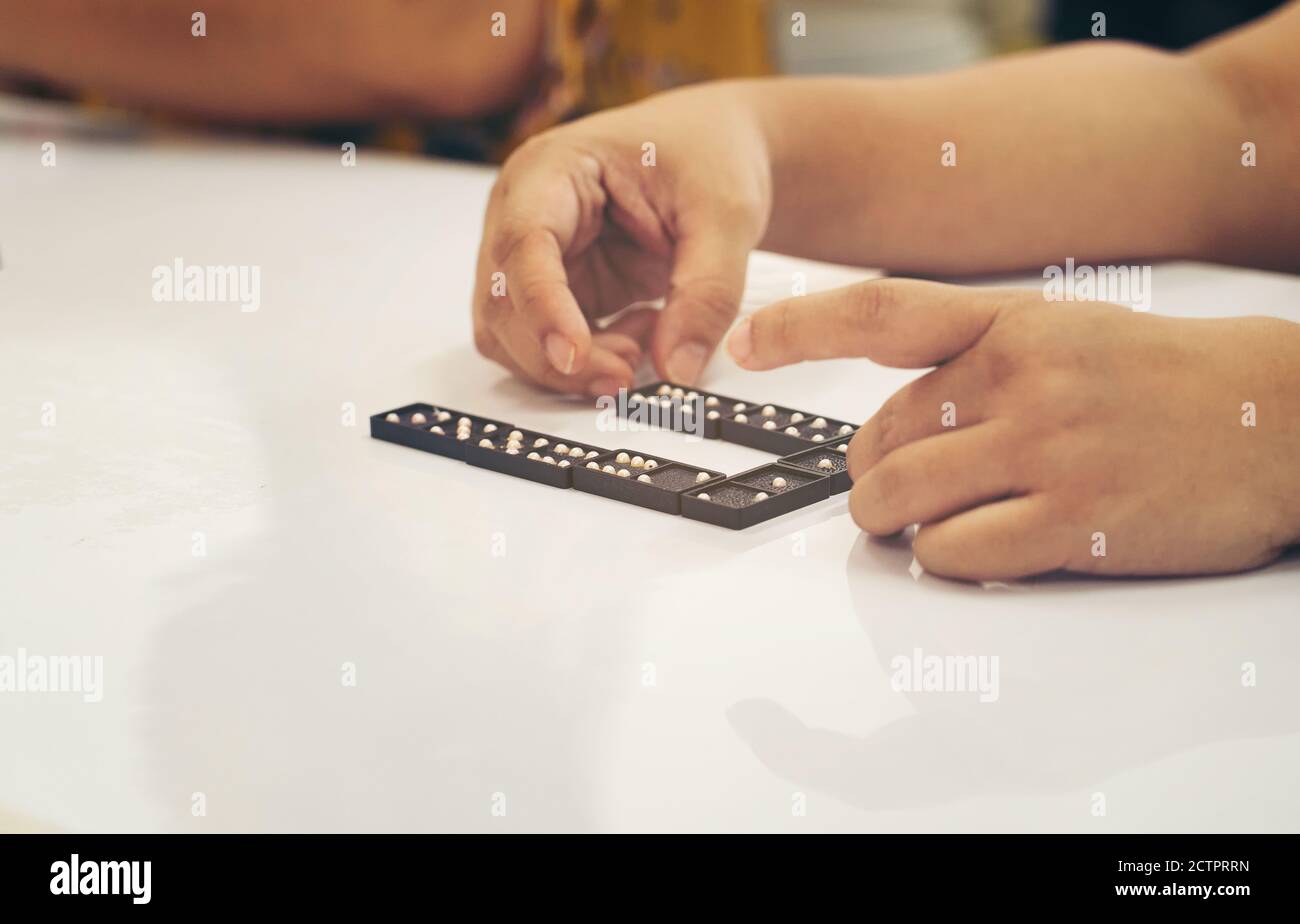 close up hand touch domino bulging play game hand strategy for blind ...
