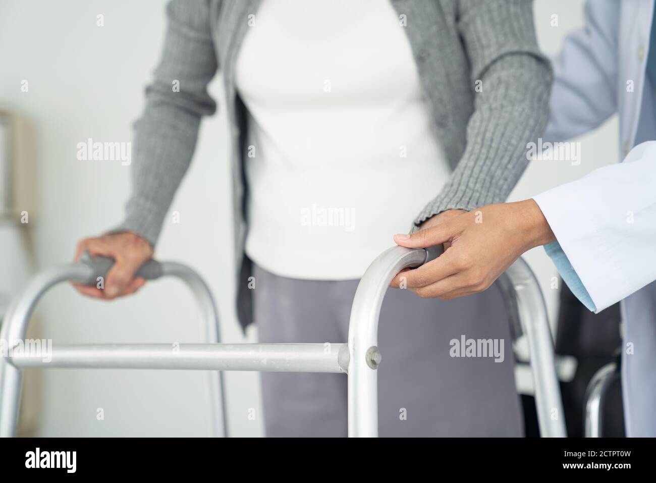 Assist patient walking nurse hi-res stock photography and images - Alamy