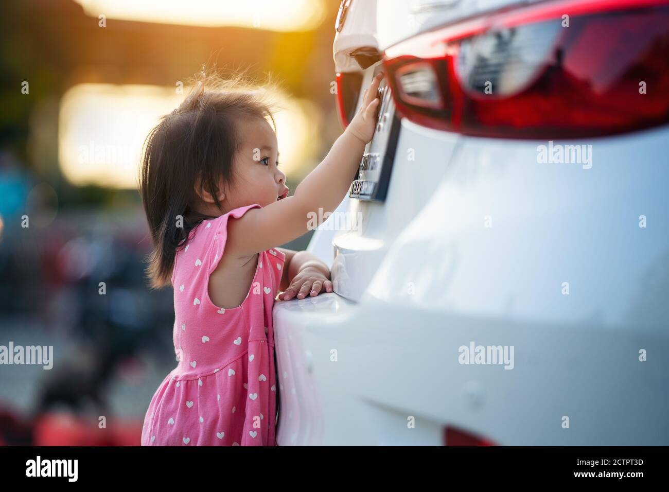 little girl looks license plate the car Stock Photo - Alamy