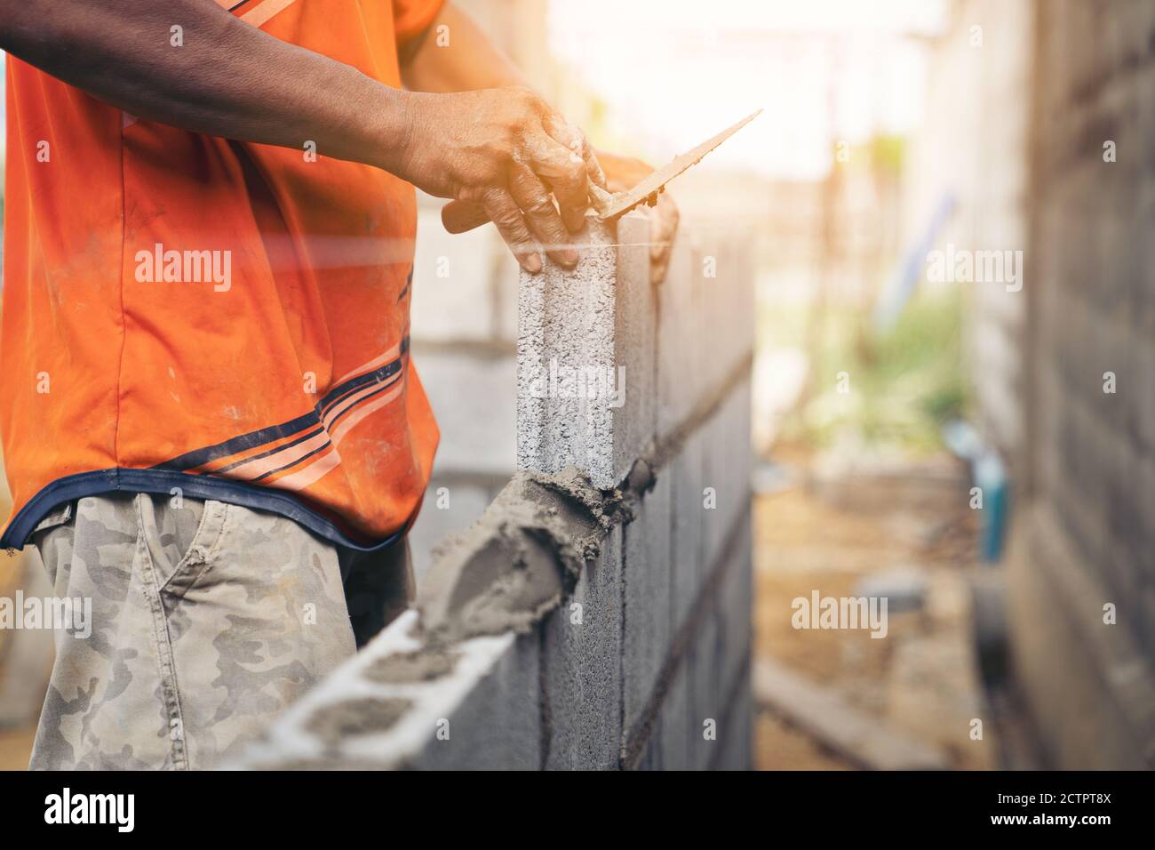 Worker building wall bricks with cement hi-res stock photography and ...