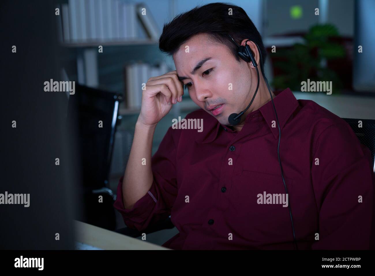 Headache anxiety call center hi-res stock photography and images - Alamy