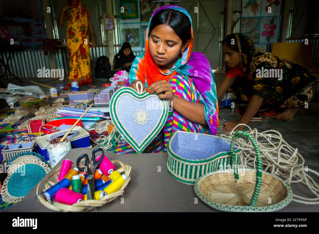 Bangladesh – May 13, 2018: A village Handicraft maker girl are making ...