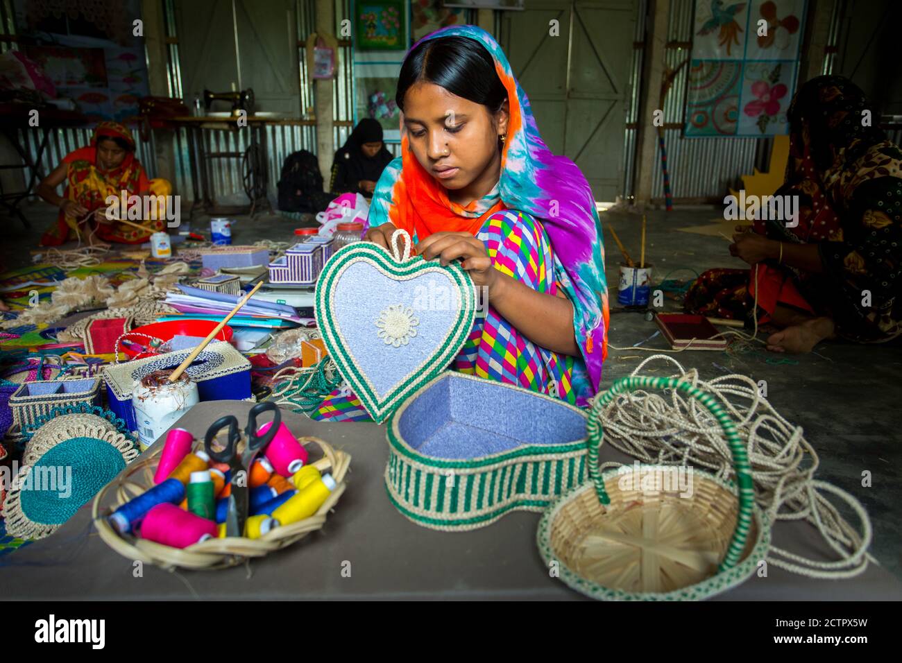 Bangladesh – May 13, 2018: A village Handicraft maker girl are making ...