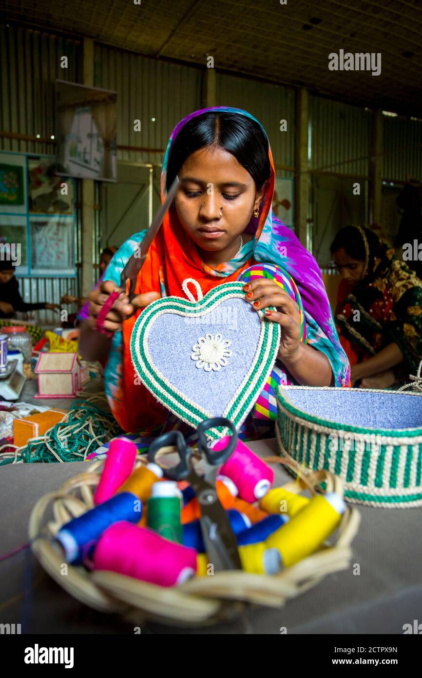 Bangladesh – May 13, 2018: A village Handicraft maker girl are making ...