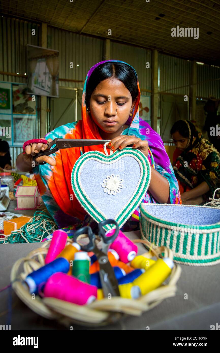 Bangladesh – May 13, 2018: A village Handicraft maker girl are making ...