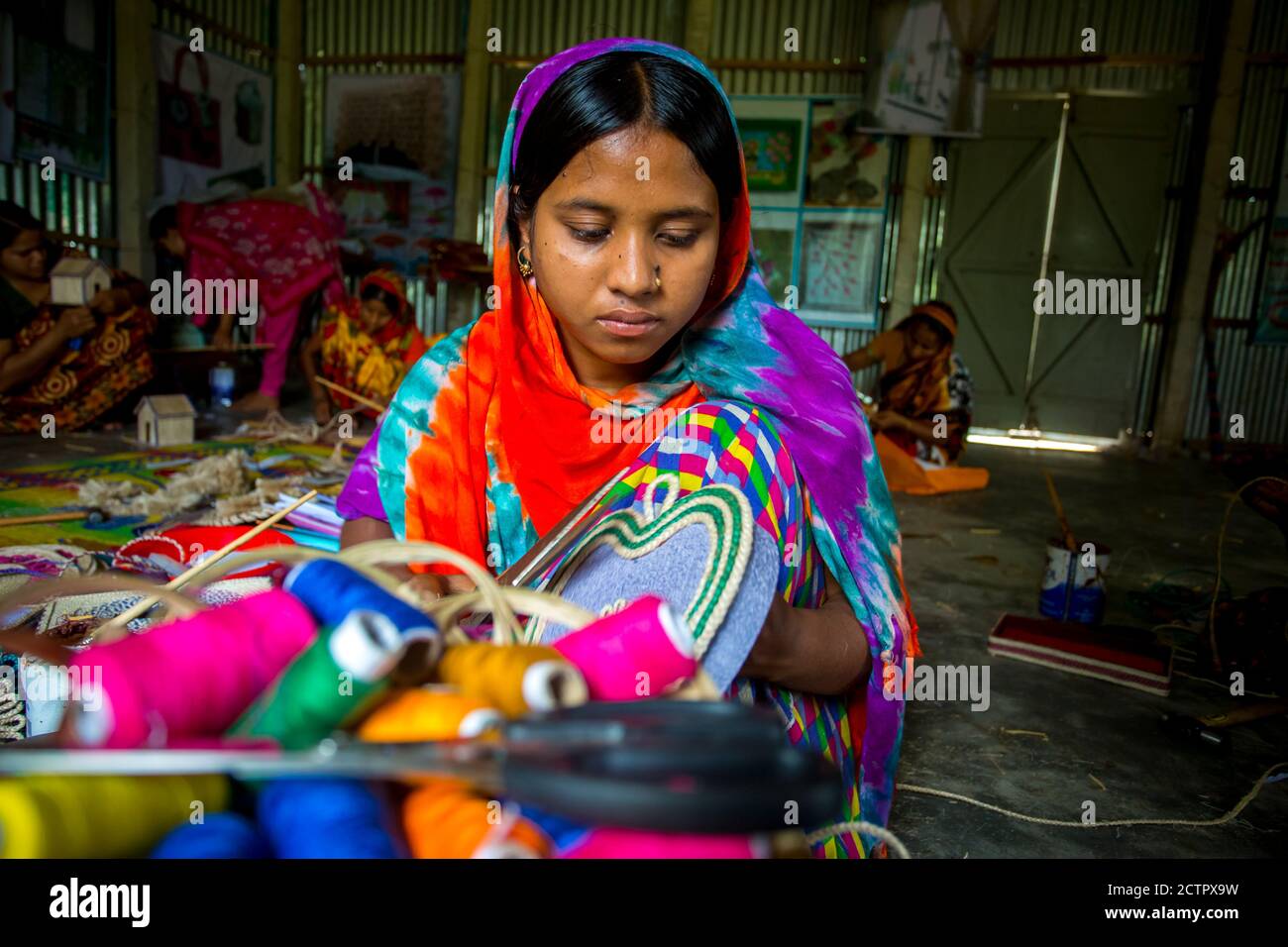 Bangladesh – May 13, 2018: A village Handicraft maker girl are making ...