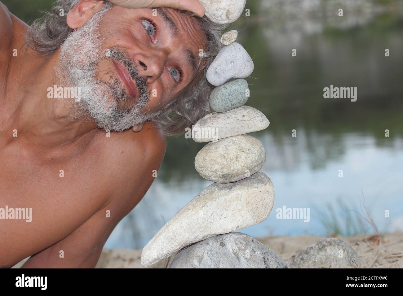 Mature man doing stone piles hi-res stock photography and images - Alamy