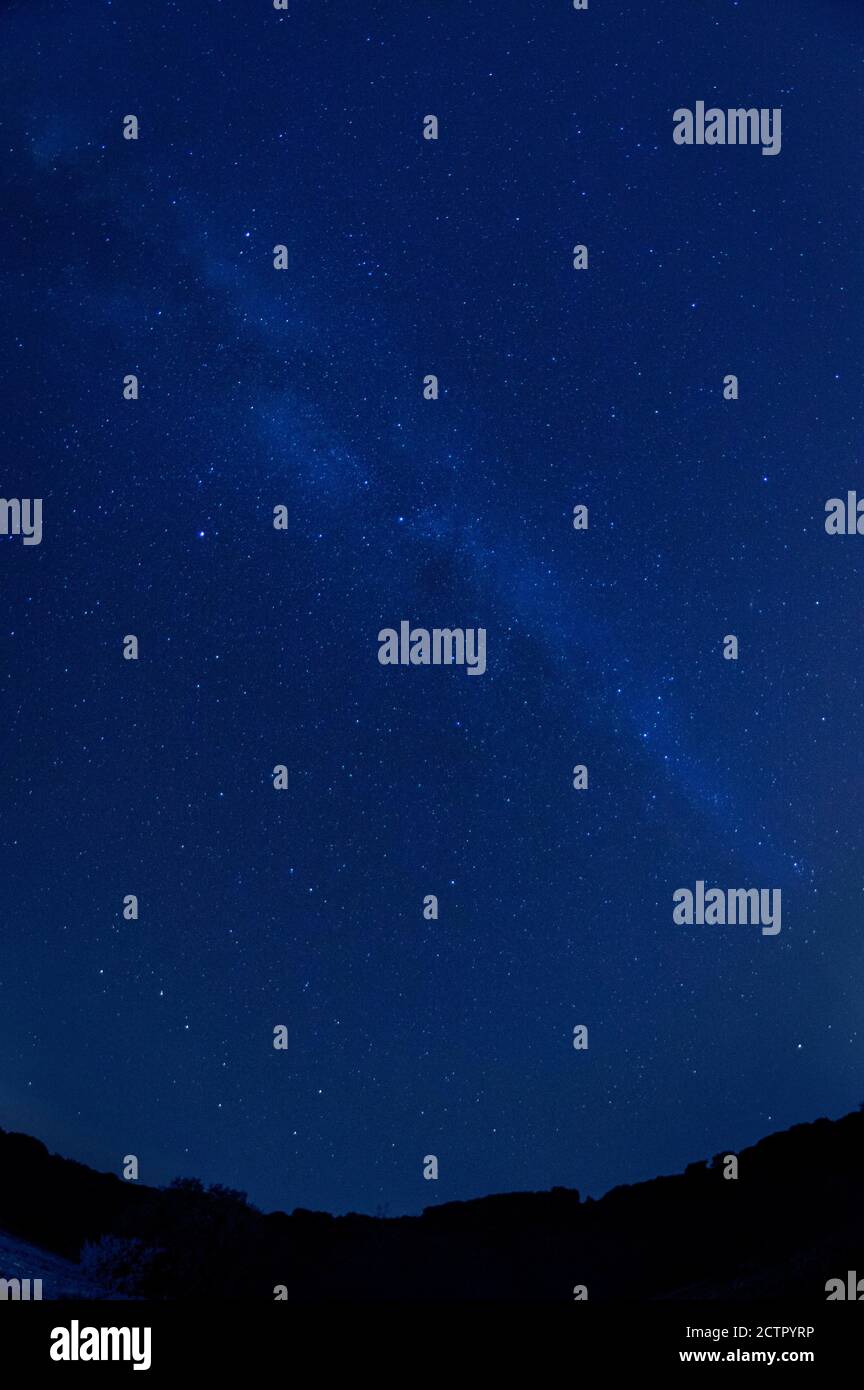 Starry night with the Milky Way crossing the sky Stock Photo - Alamy