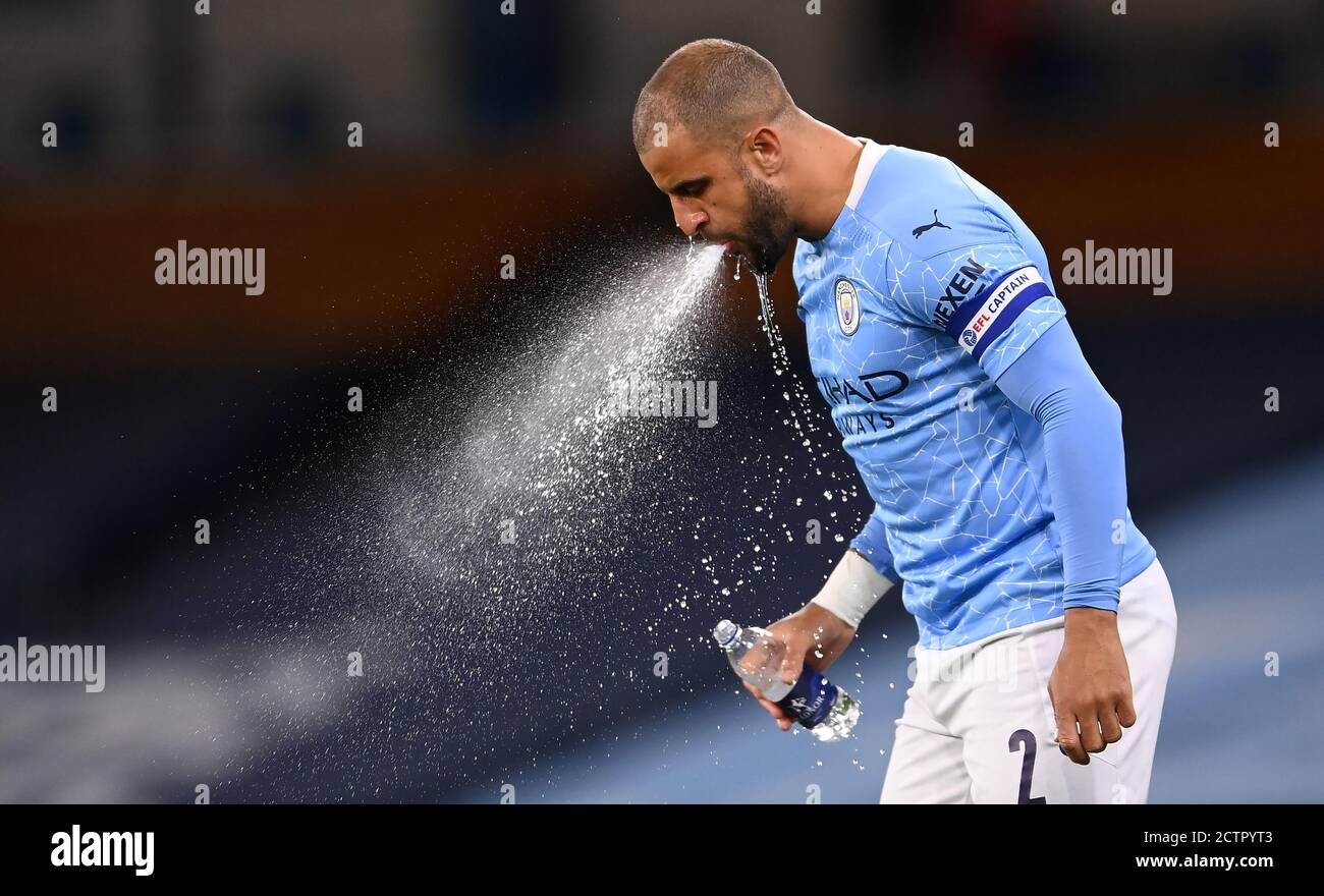 Manchester City's Kyle Walker sprays water before the Carabao Cup third ...