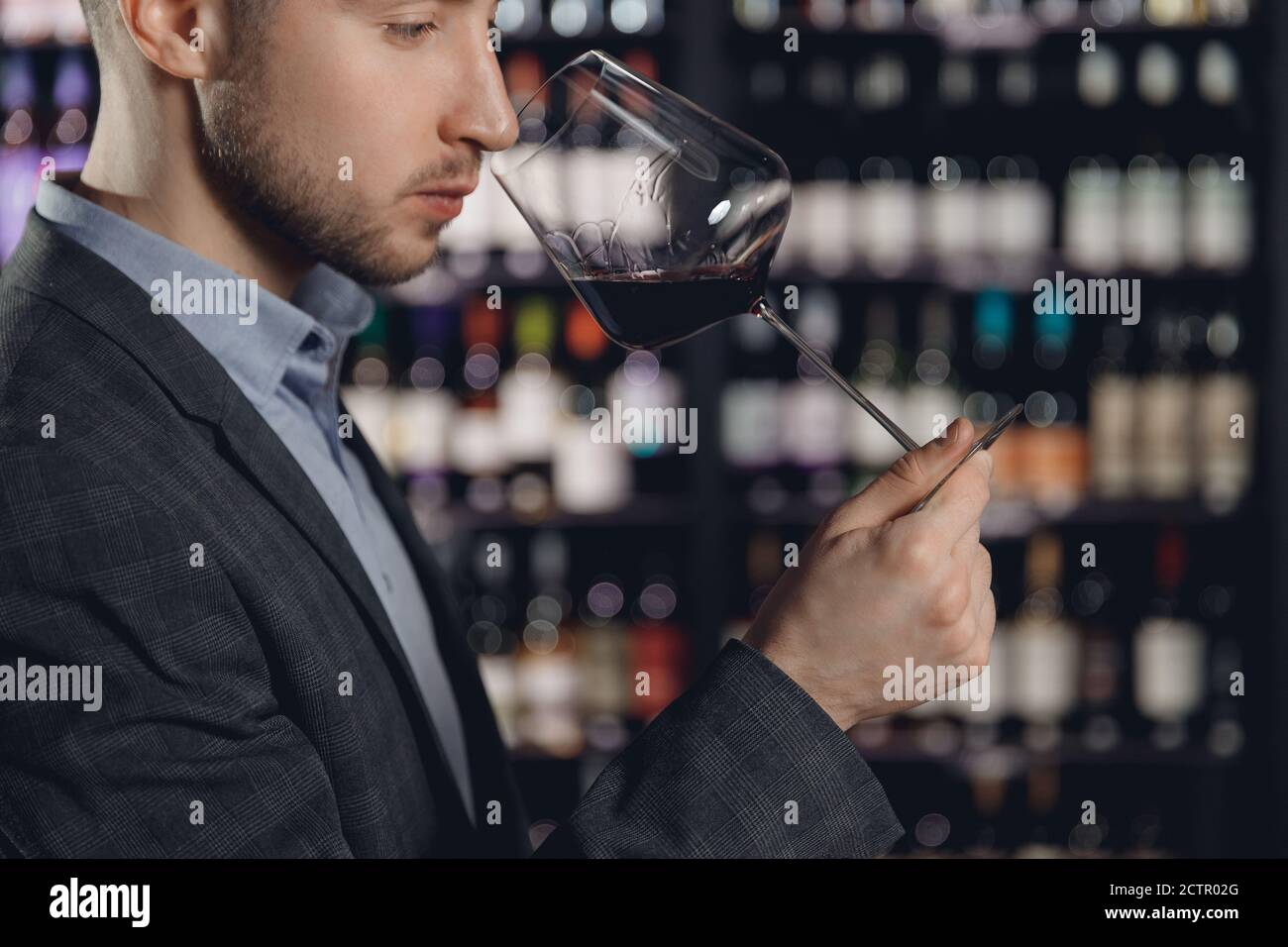 Winemaker sommelier man sniffing aroma red wine in glass Stock Photo ...