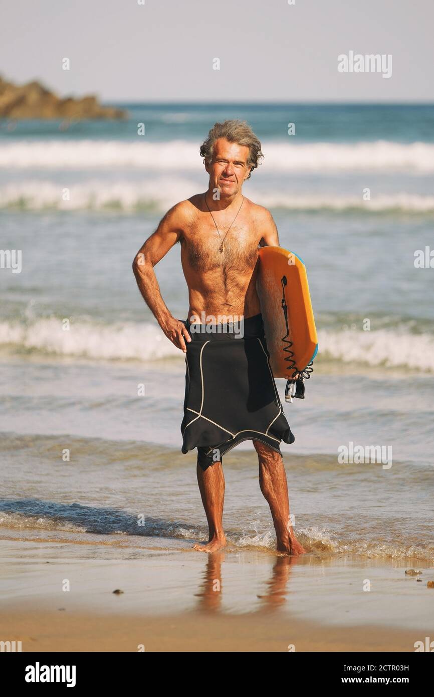 man practicing surfing on the basque coast, donostia-spain Stock Photo ...