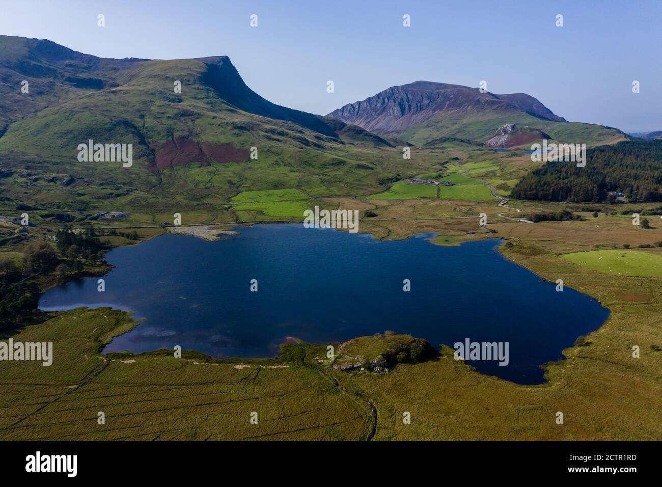 Aerial view of a winding road through beautiful mountainous scenery ...