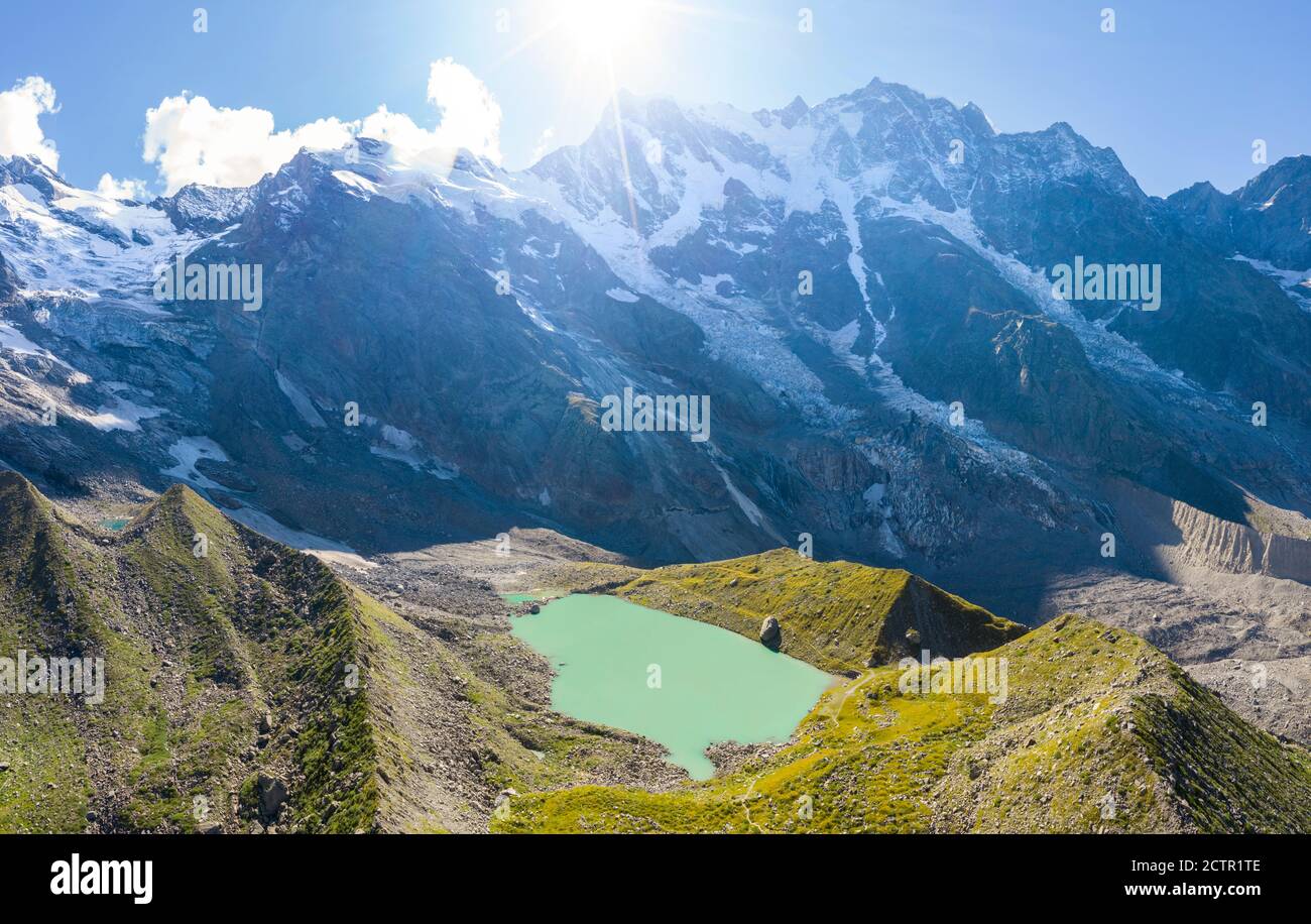 Aerial view of the Locce lake and the Mount Rosa massif. Alpe Pedriola ...
