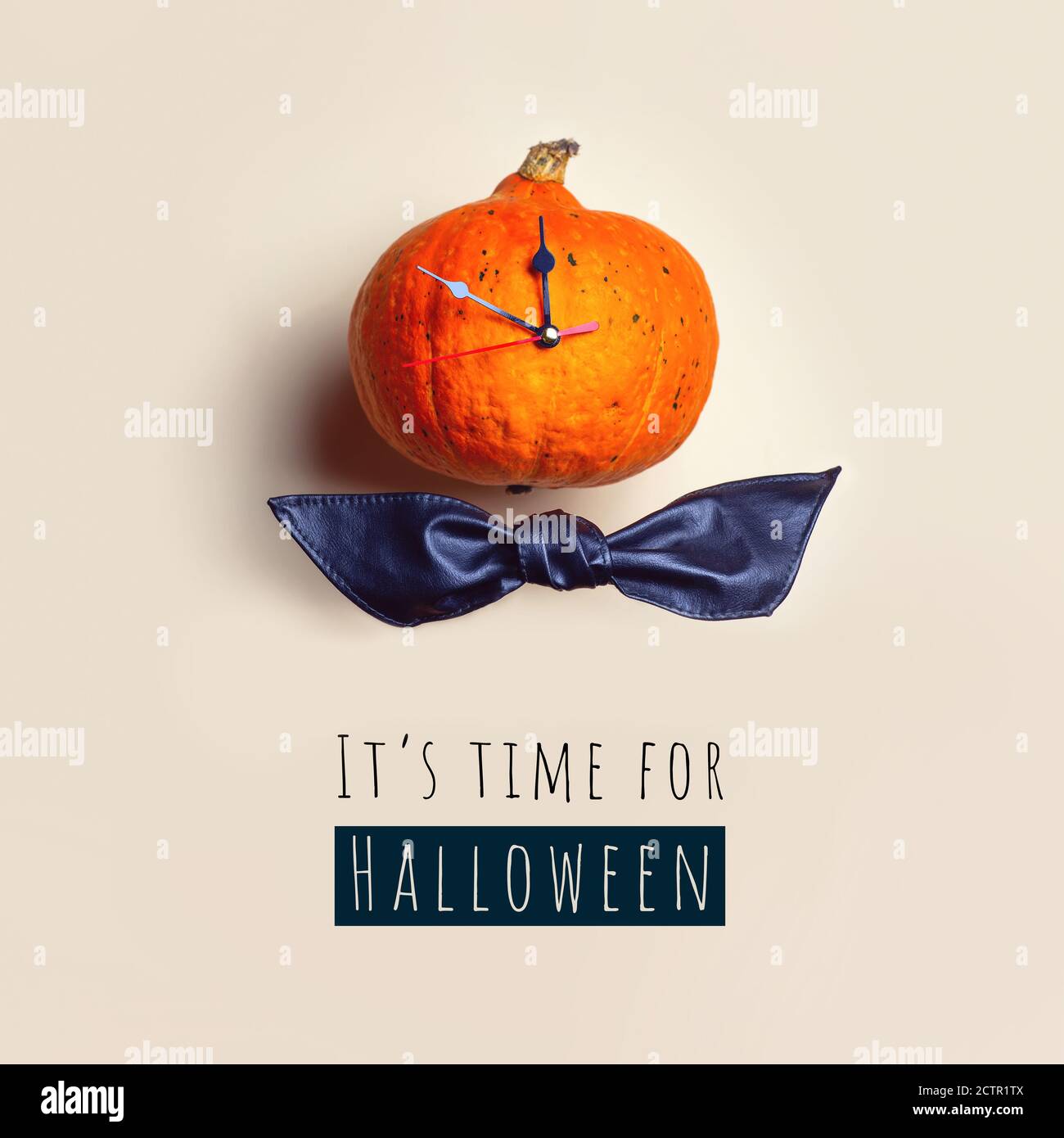 Pumpkin clock shows the time before Halloween. Concept Stock Photo - Alamy