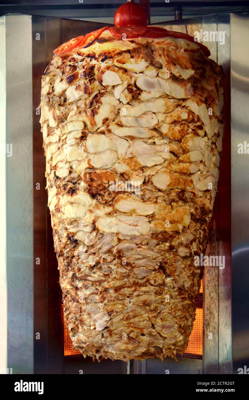Vertically roasted chicken meat doner kebab Stock Photo - Alamy