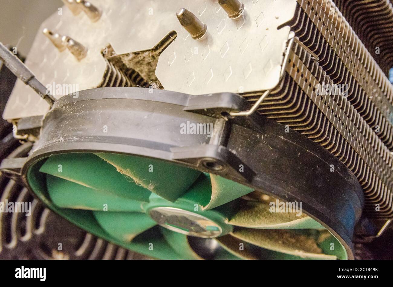 Dust on green CPU cooler PC computer with motherboard and computer case fragment close up Stock ...