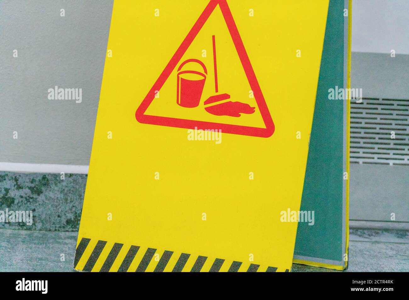 yellow warning sign "cleaning" close-up Stock Photo - Alamy