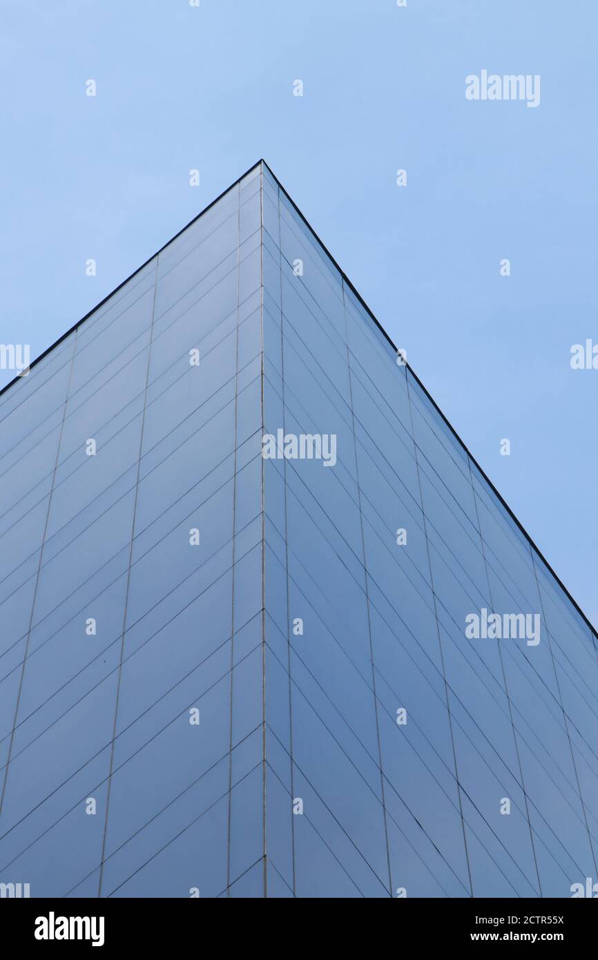 Vertical low angle shot of a tall glass building at daytime Stock Photo ...