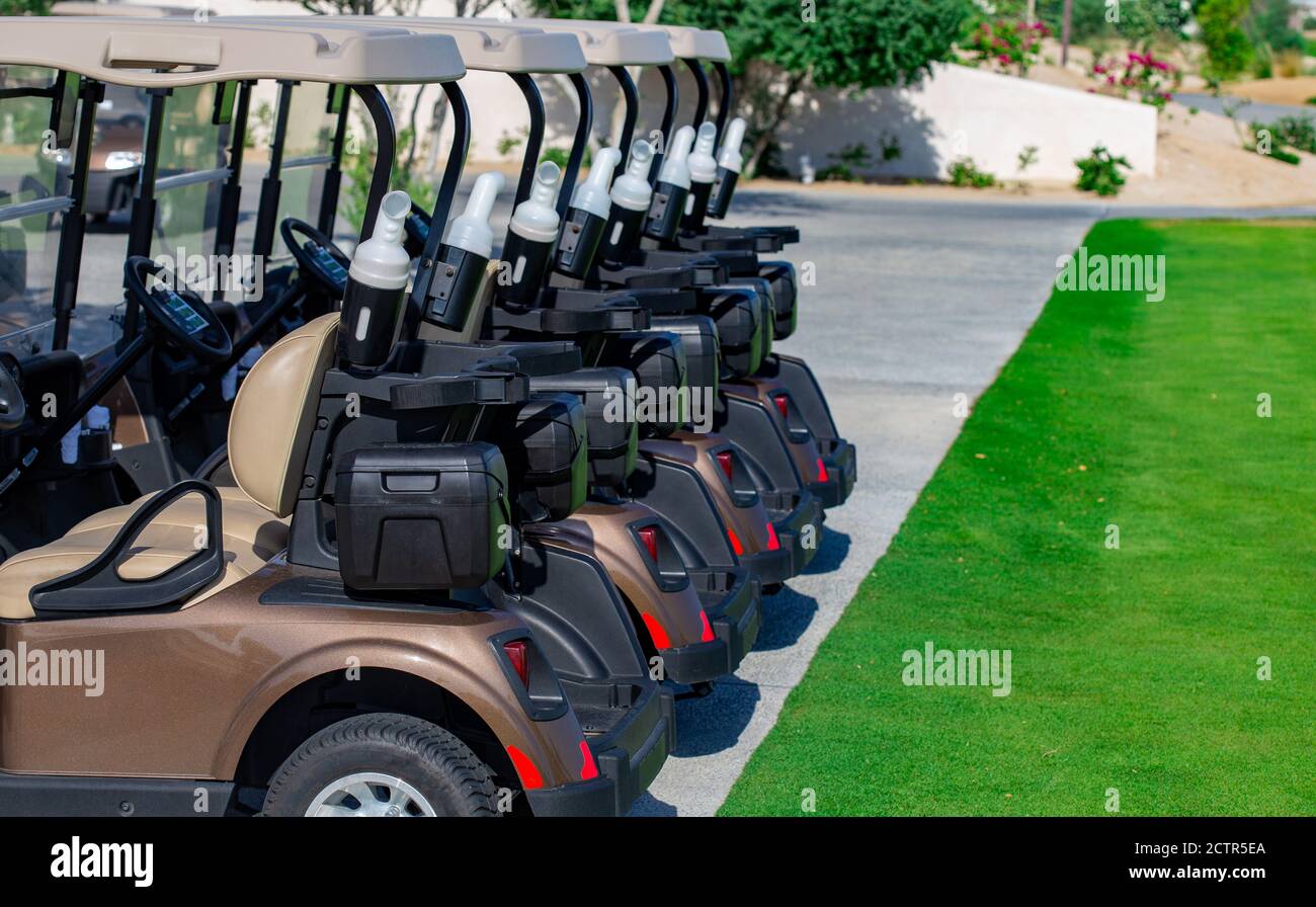 Background image of Golf carts parked on a golf closure in a line.Golf ...