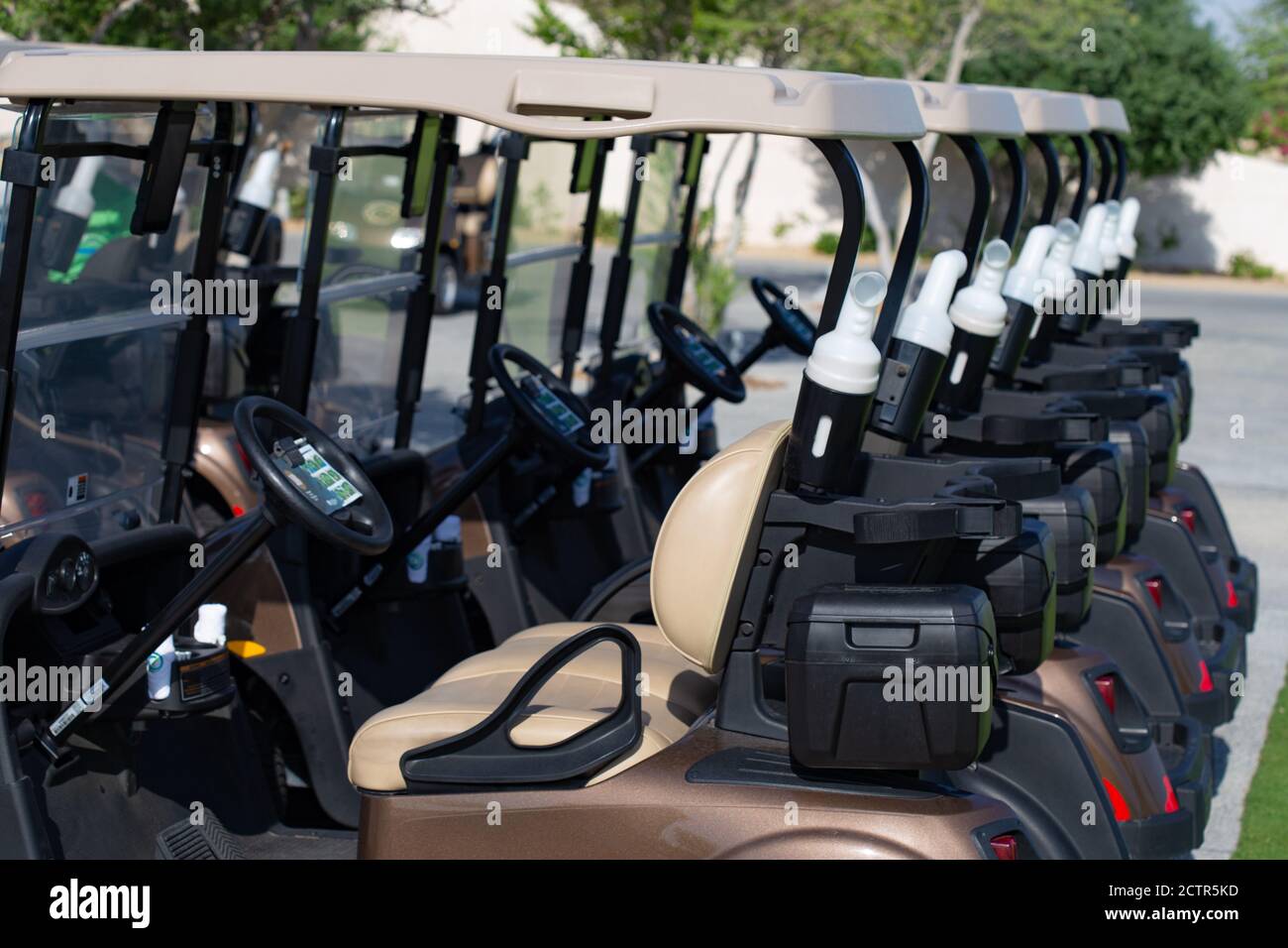 Background image of Golf carts parked on a golf closure in a line.Golf ...