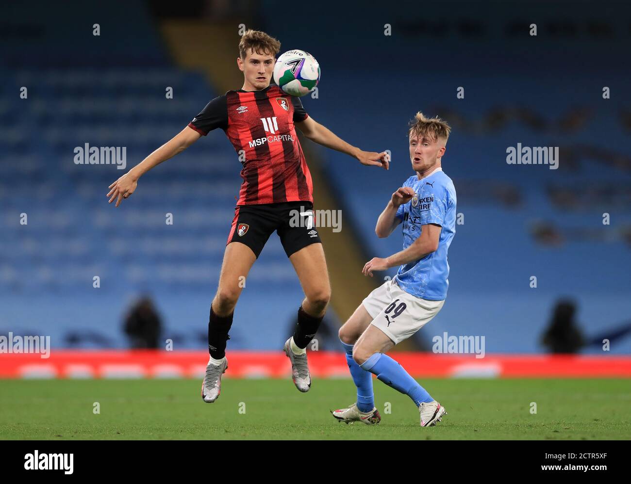 AFC Bournemouth's David Brooks (left) and Manchester City's Tommy Doyle ...