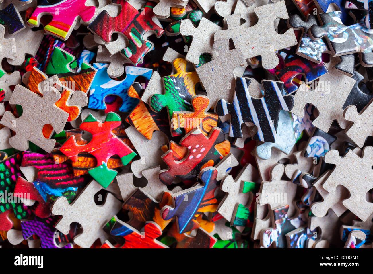 Disassembled puzzle colored pieces Stock Photo - Alamy