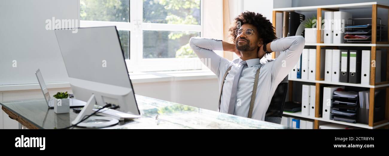 Businessman desk office leaning back hi-res stock photography and ...