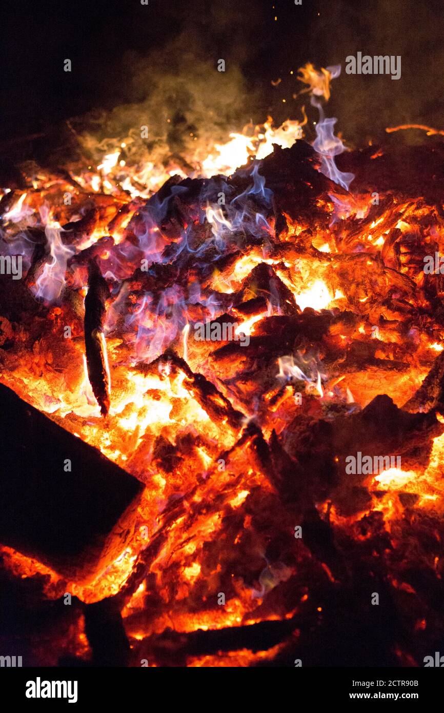 Close-Up of Red Embers and Flames in Bonfire Stock Photo - Alamy