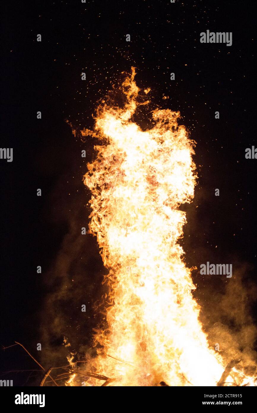 Flaming Embers spreading from Bonfire at Night Stock Photo - Alamy